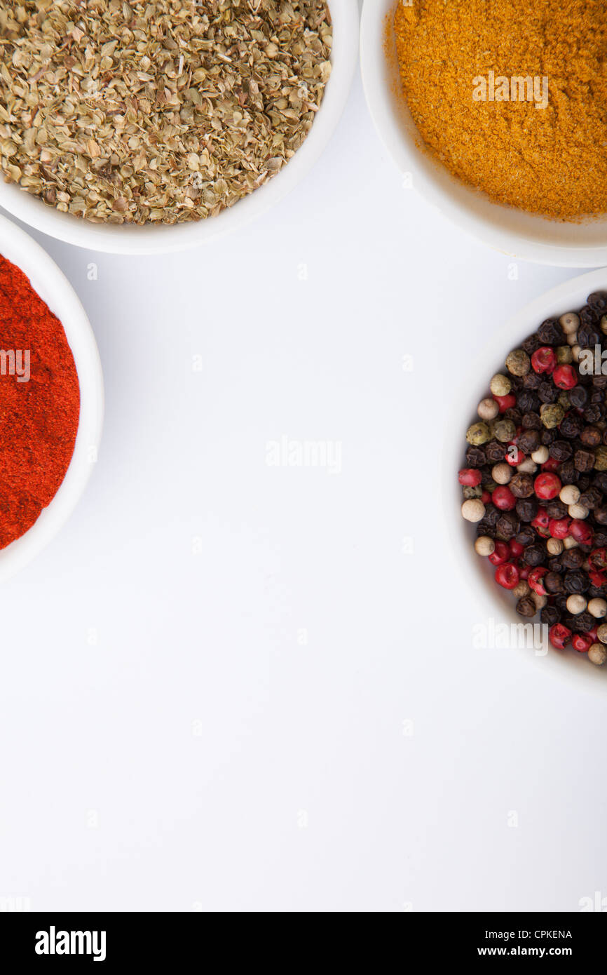 Colorful spices in white pods isolated on white Stock Photo - Alamy
