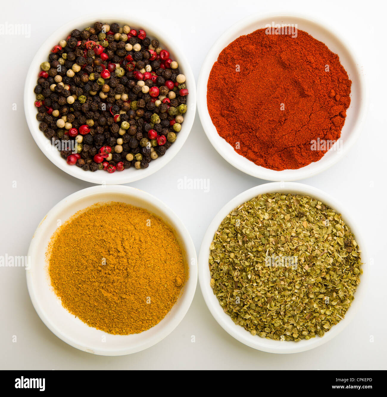 Colorful spices in white pods isolated on white Stock Photo - Alamy