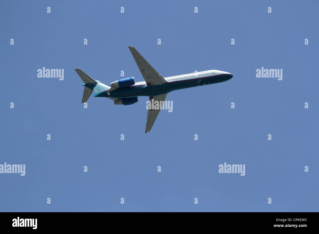 A passenger jet from below Stock Photo - Alamy