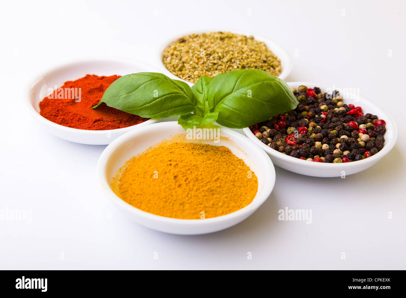 Colorful spices in white pods isolated on white Stock Photo - Alamy
