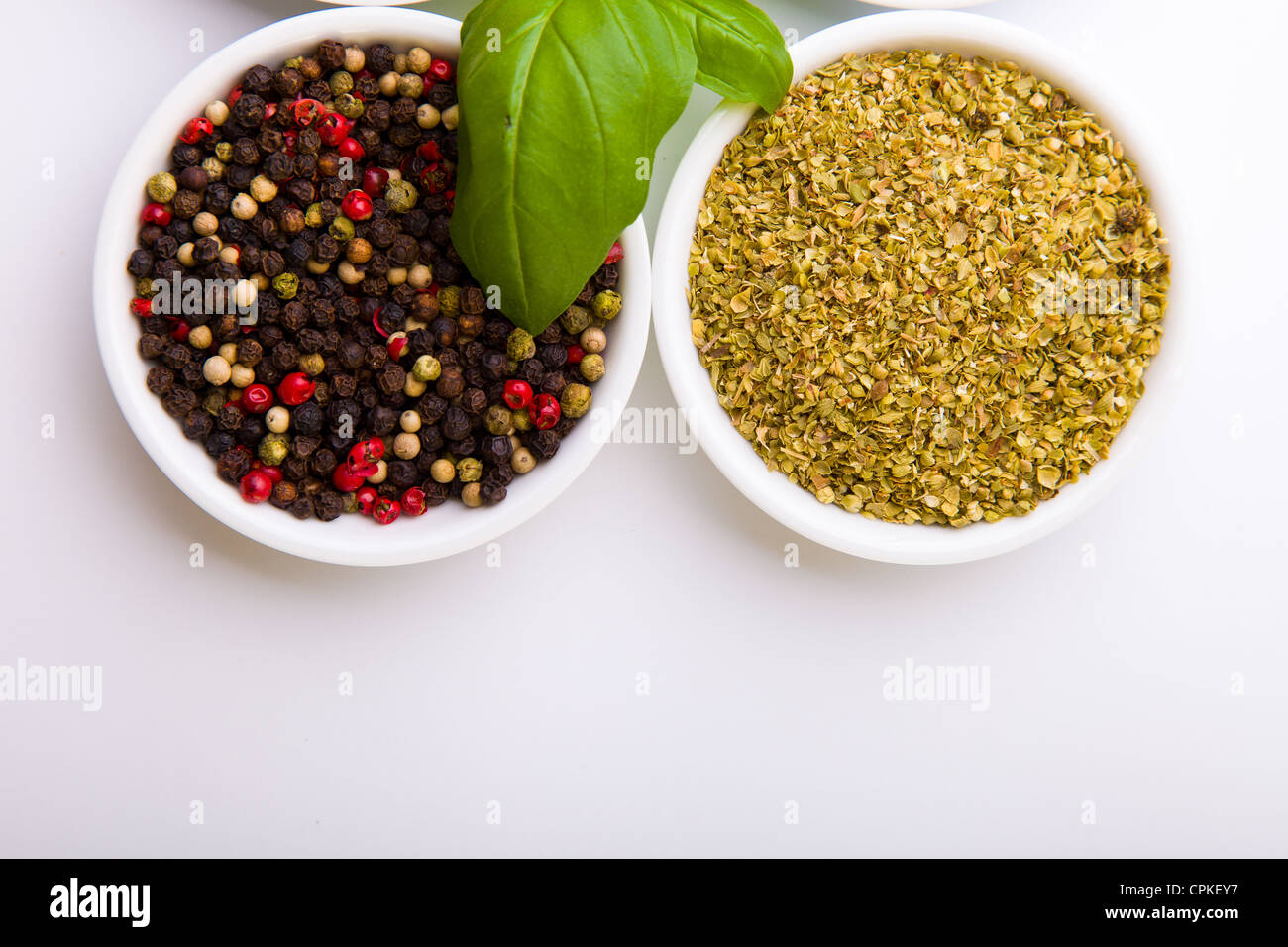 Colorful spices in white pods isolated on white Stock Photo - Alamy