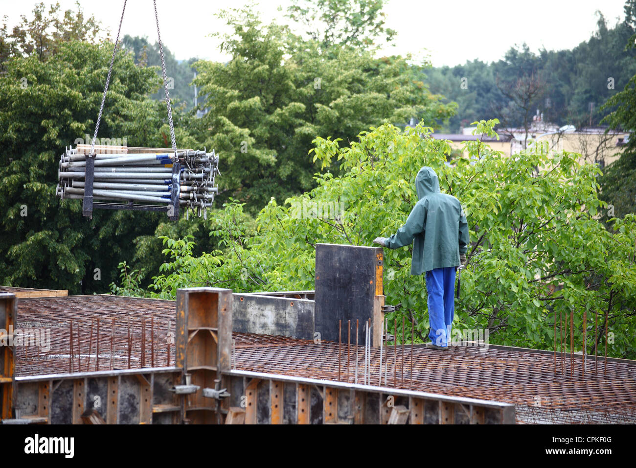 construction site with worker working planks metal wall Stock Photo - Alamy
