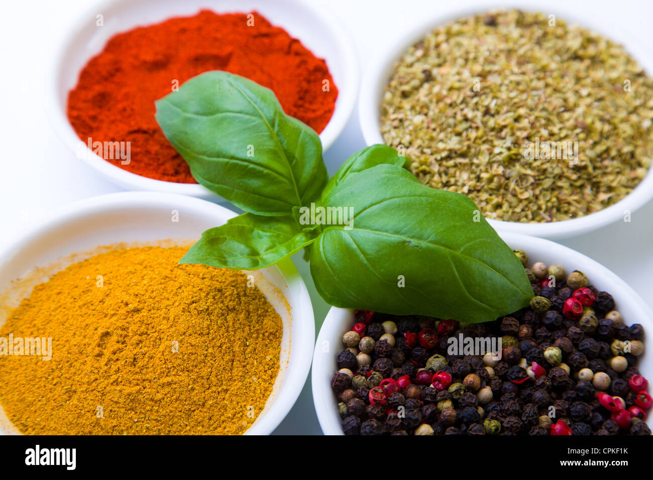 Colorful spices in white pods isolated on white Stock Photo - Alamy