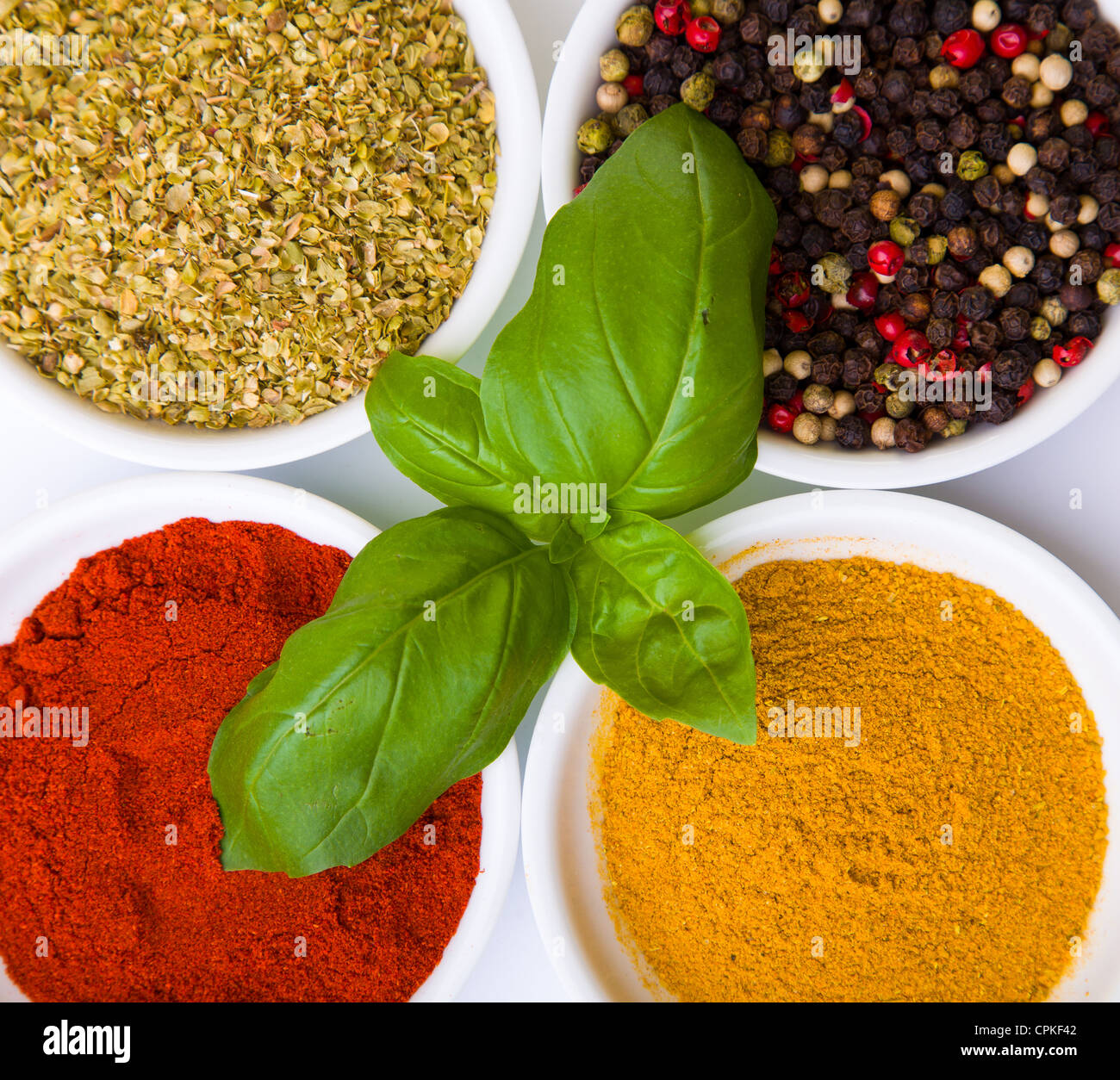 Colorful spices in white pods isolated on white Stock Photo - Alamy