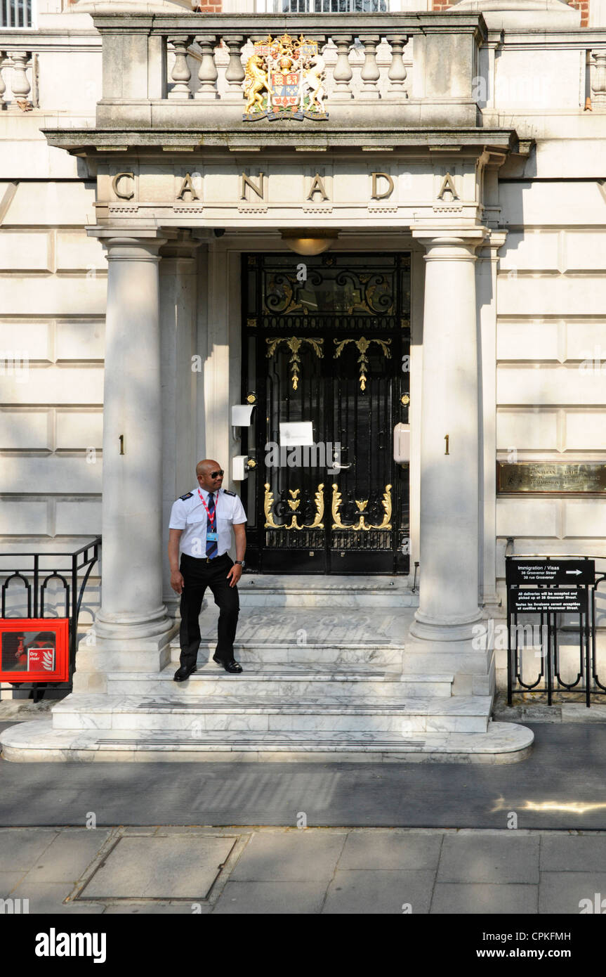 Security person outside entrance to Canadian High Commission building ...
