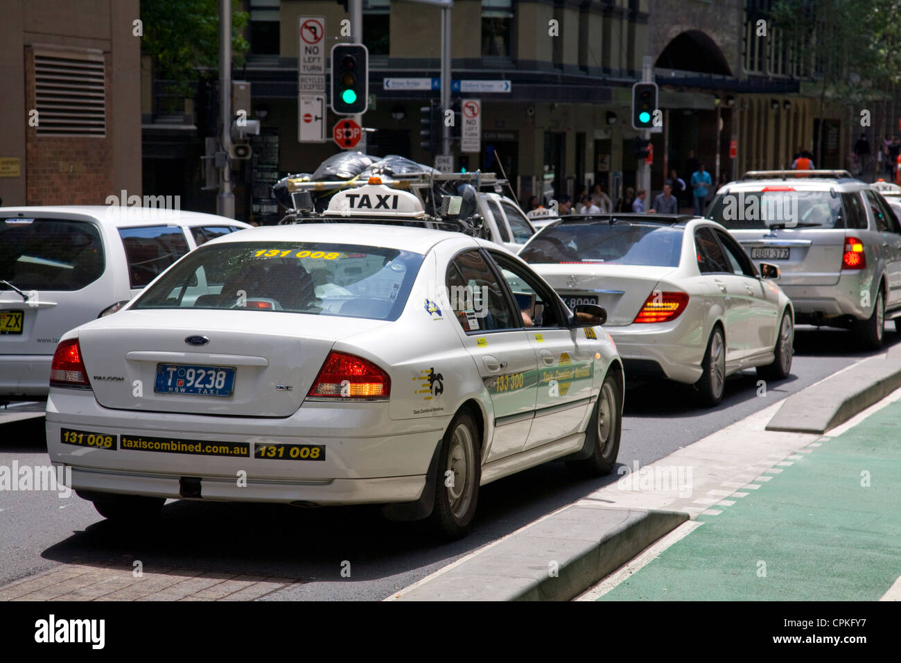 Australian taxi car and traffic at the lights in Sydney's york street ...