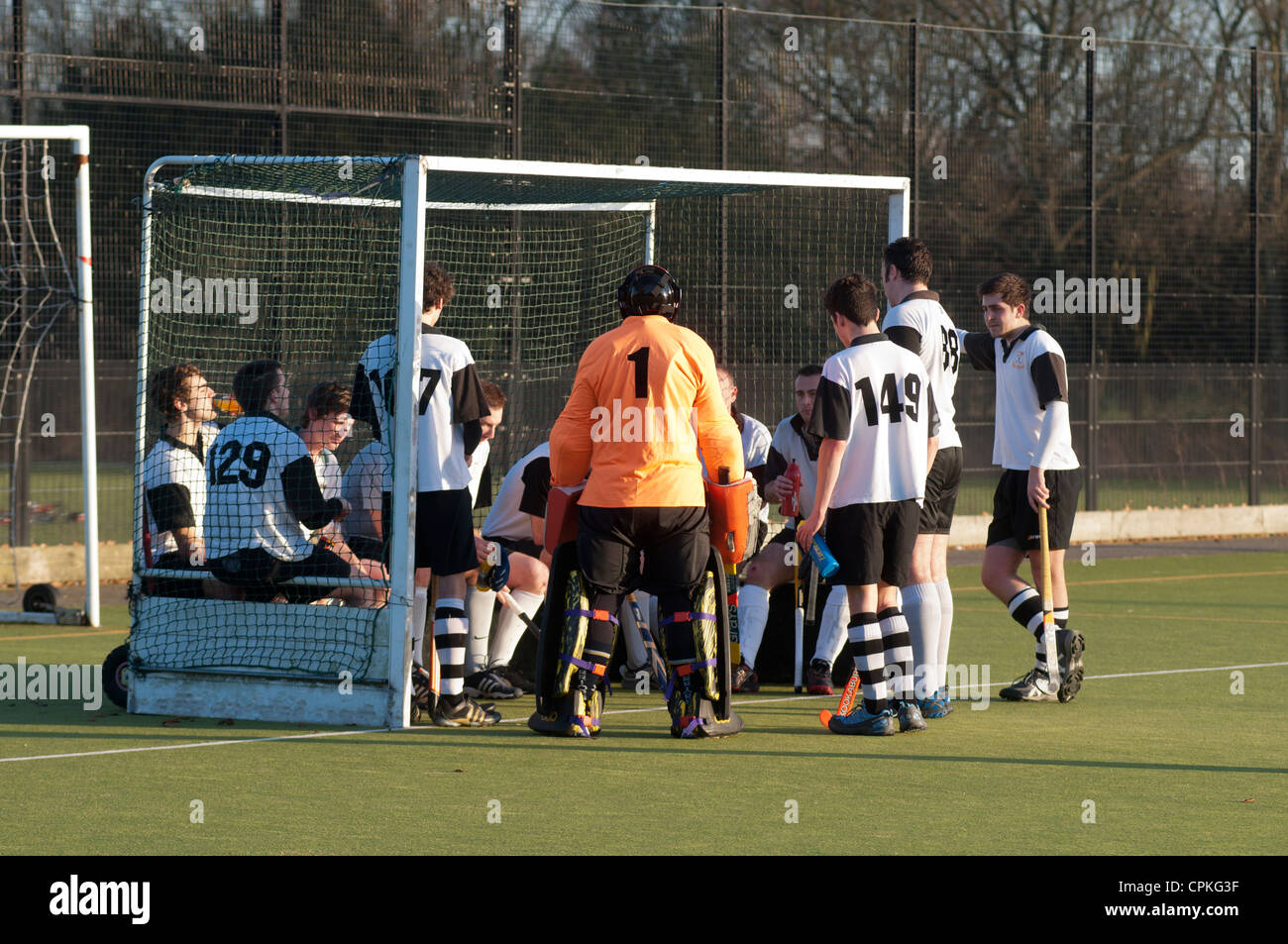 Half time team talk at club hockey match, UK Stock Photo - Alamy