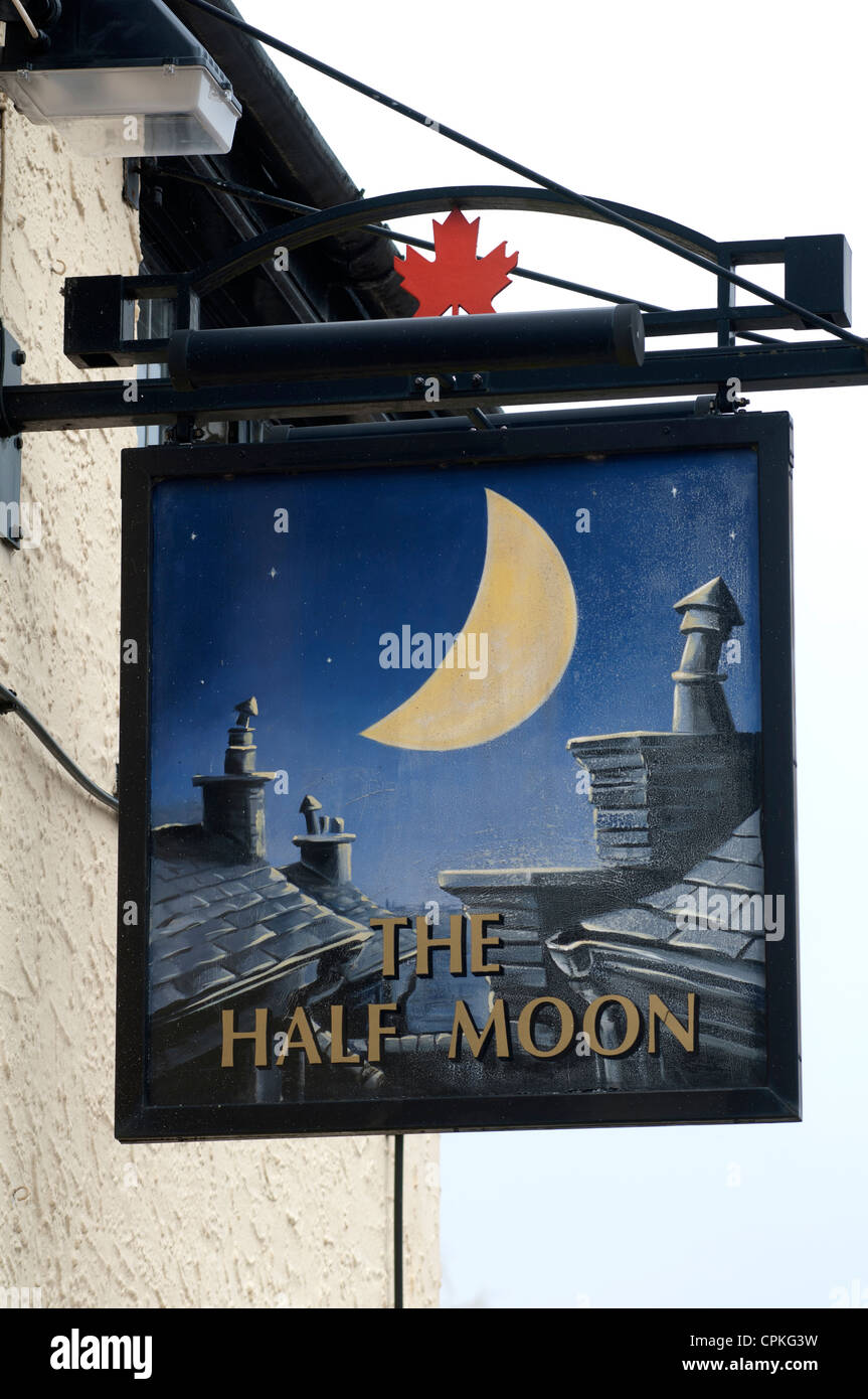 The Half Moon pub sign, Wolston, Warwickshire, UK Stock Photo - Alamy