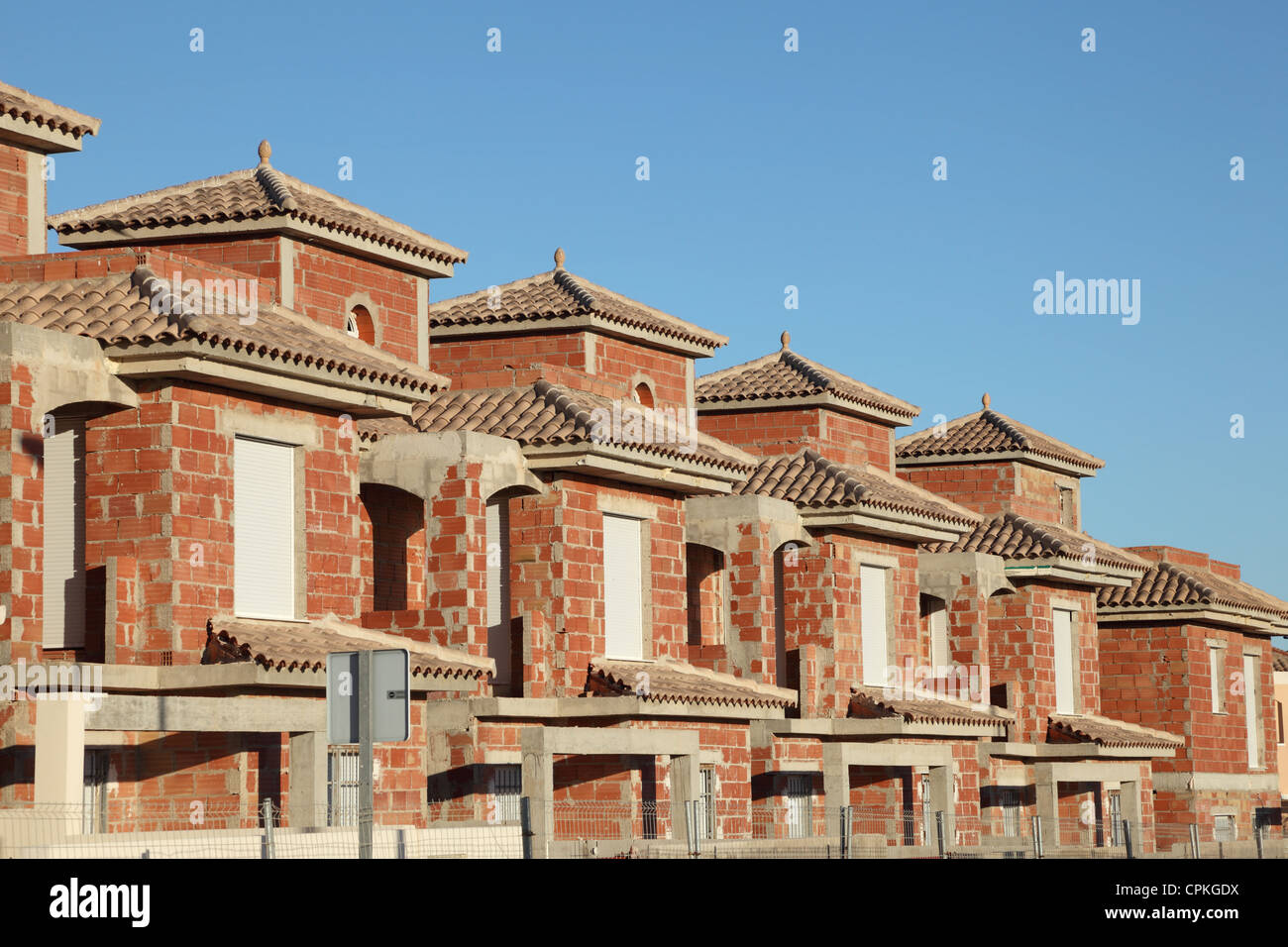 Row of red brick buildings hi-res stock photography and images - Alamy
