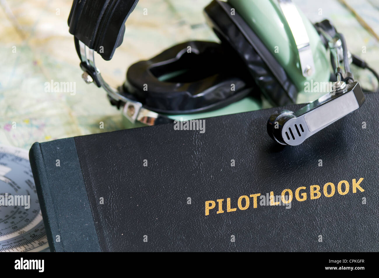 pilot logbook and headset on a map Stock Photo - Alamy