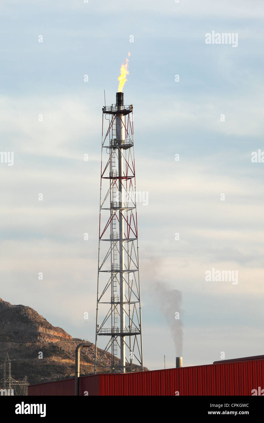 Gas burning refinery torch Stock Photo - Alamy