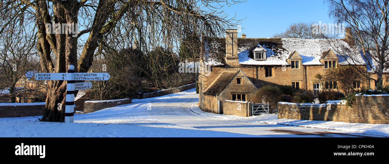 A snowy winter scene over Duddington village, Northamptonshire England ...