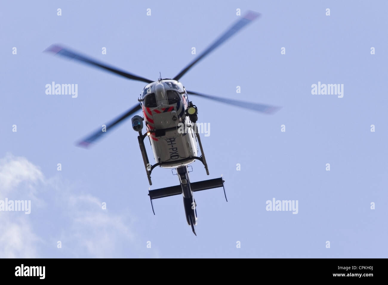 Dutch police helicopter with blue sky background Stock Photo - Alamy