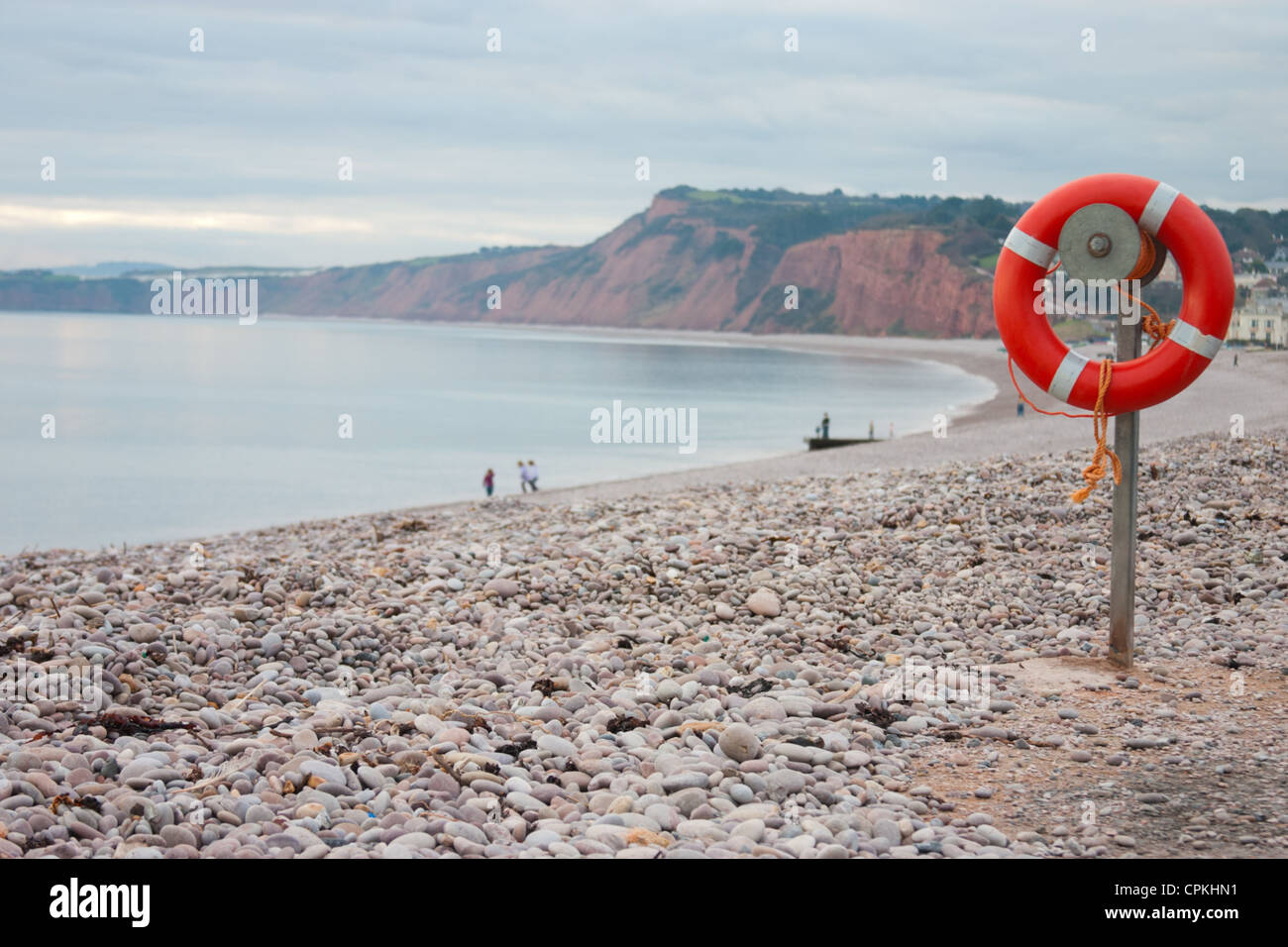 A safety ring stood on a beach of pebbles Stock Photo - Alamy