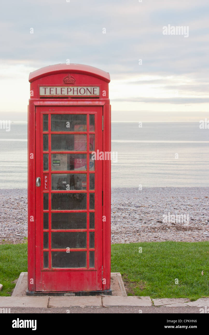 A traditional red phone box by the beach Stock Photo - Alamy