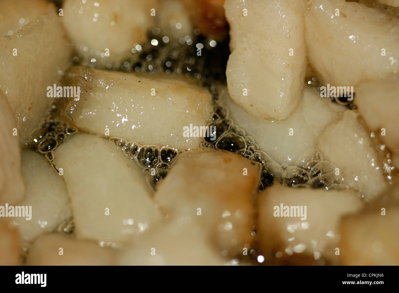 Frying lard in order to dry render it Stock Photo - Alamy