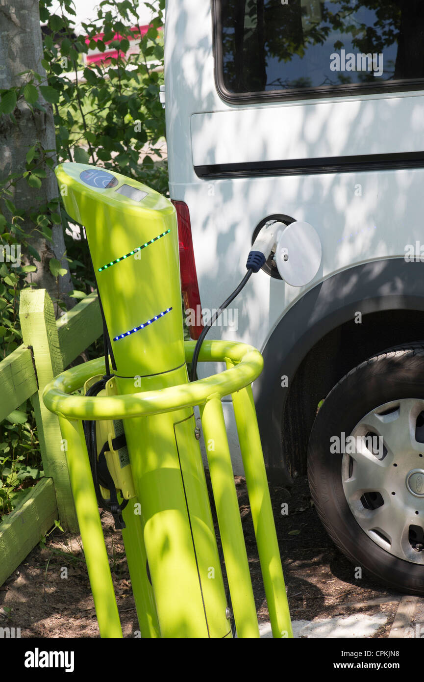 Electric car recharging batteries at a charging terminal Stock Photo ...