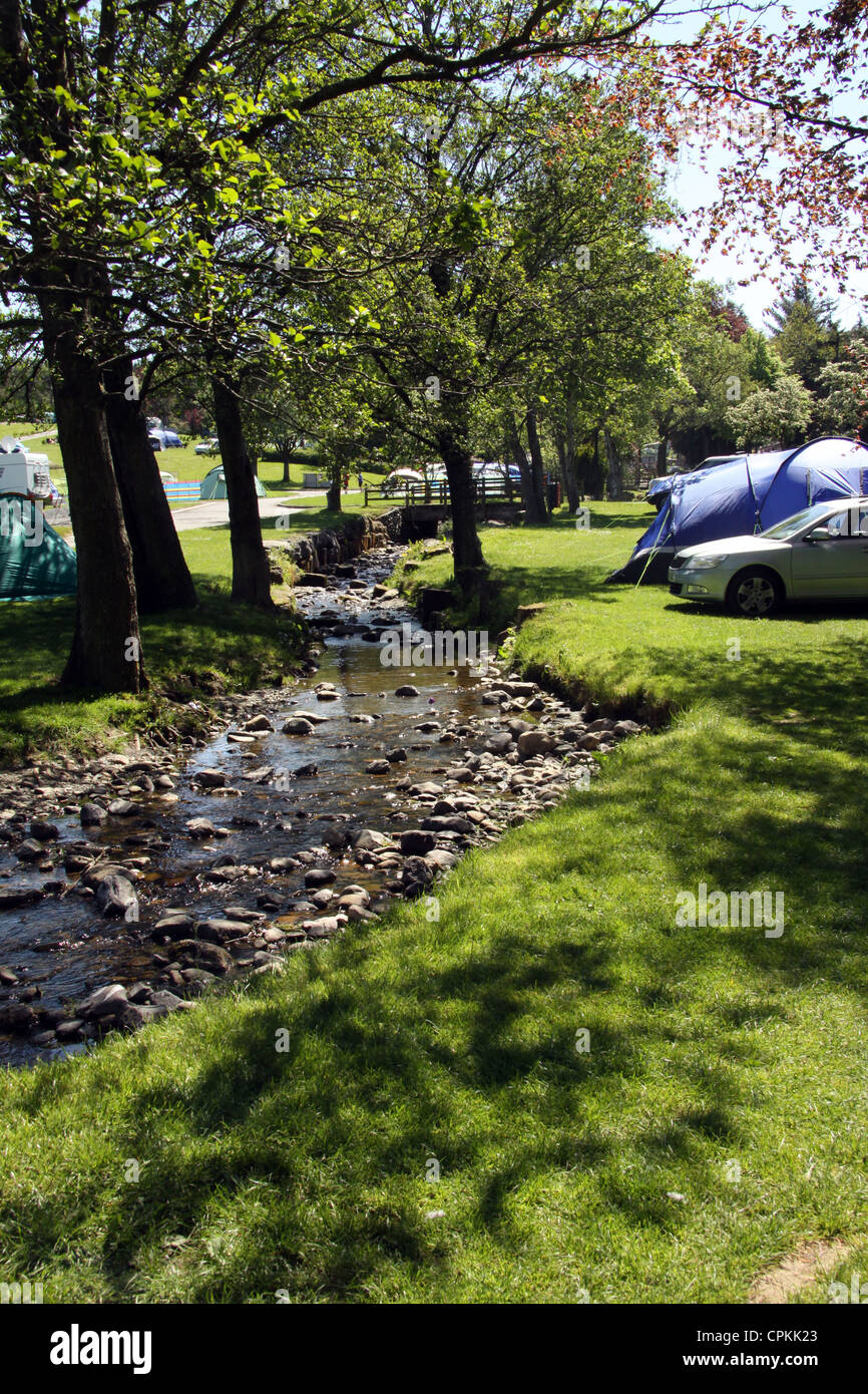 pretty stream through a campsite Stock Photo - Alamy