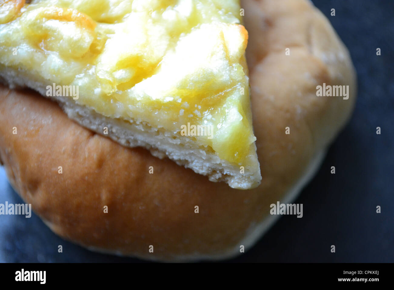 Sliced apple pie on a white bread roll Stock Photo - Alamy