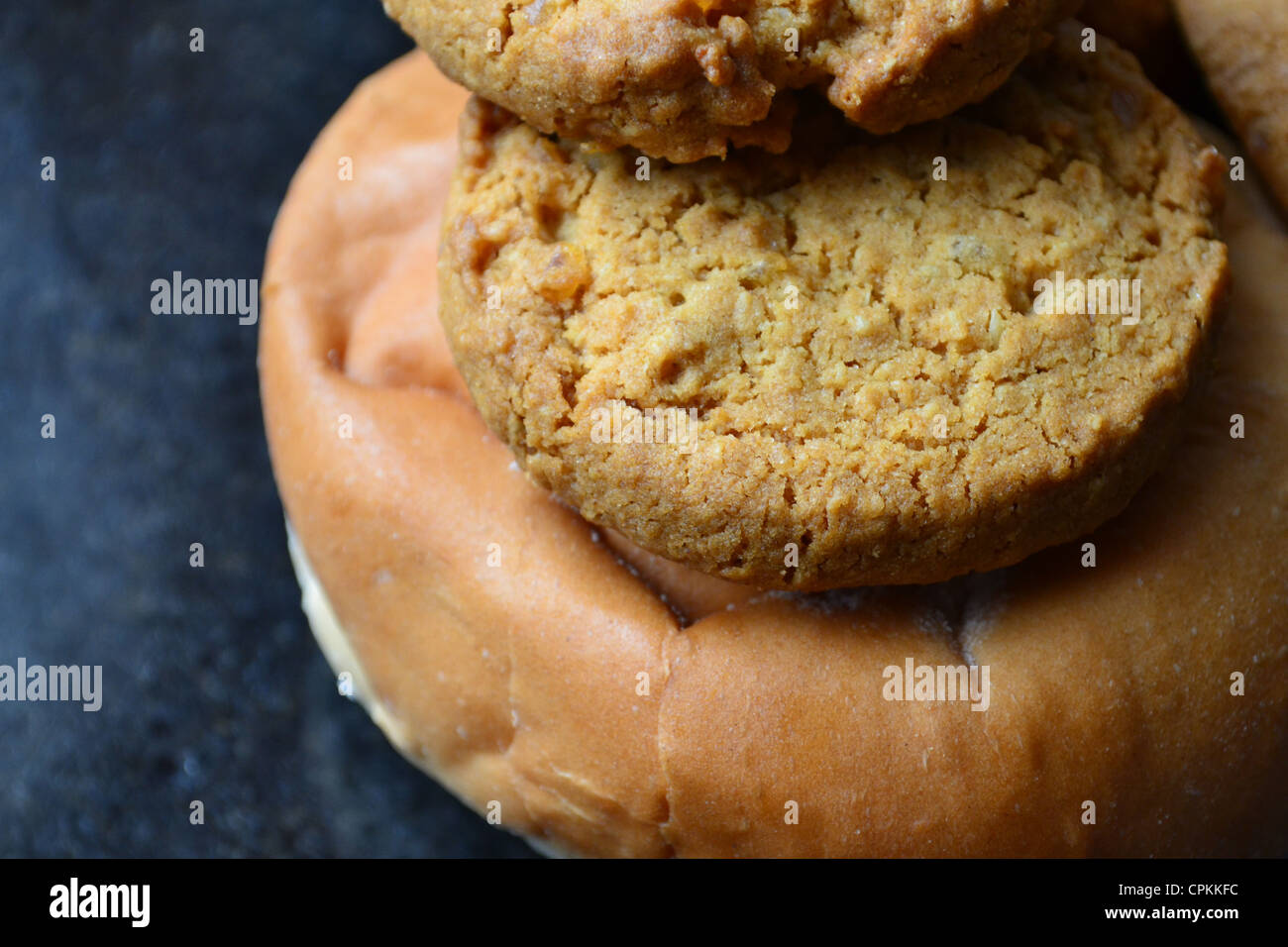 Cookie on top of White Bread Roll Stock Photo - Alamy