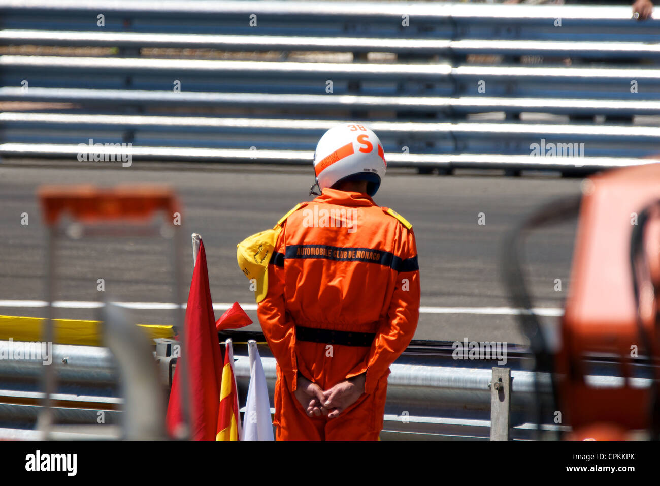 A flag marshall standing at the side of the track at the Formula 1 ...