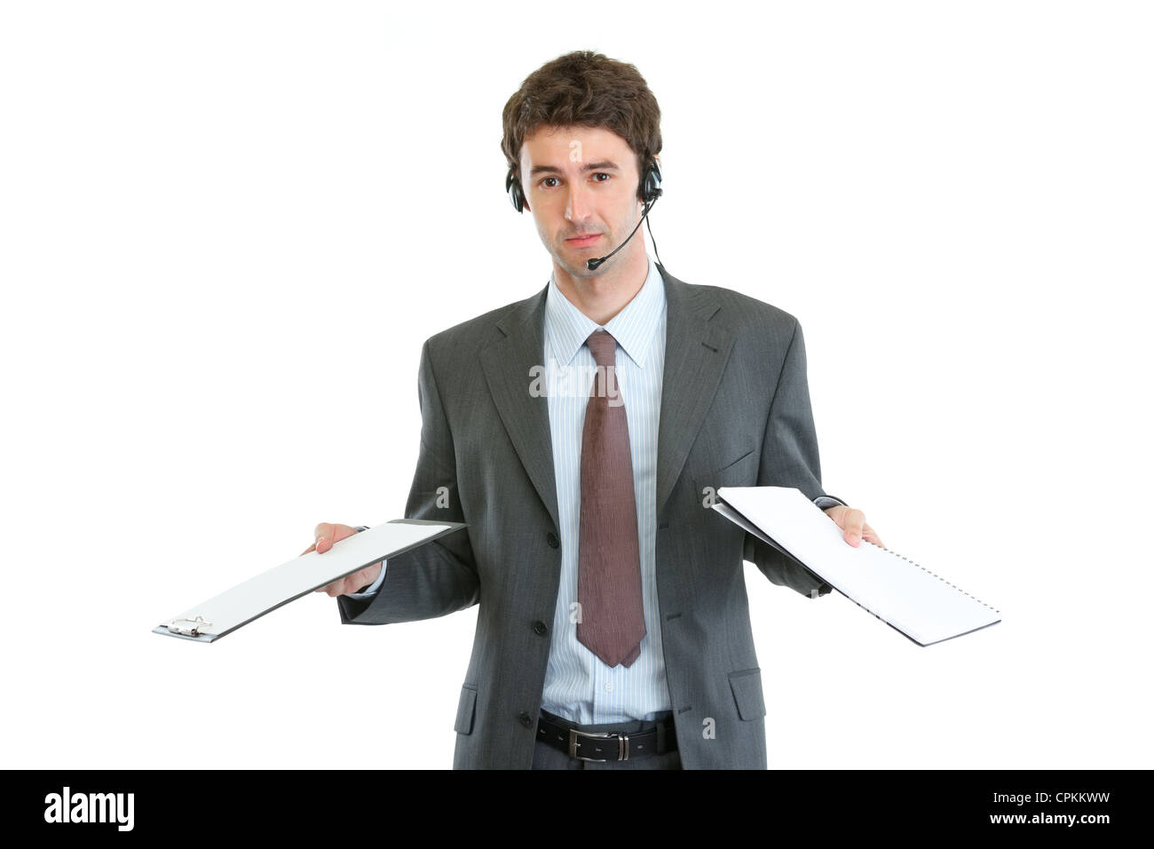Business operator with headset confused in pile documents Stock Photo ...
