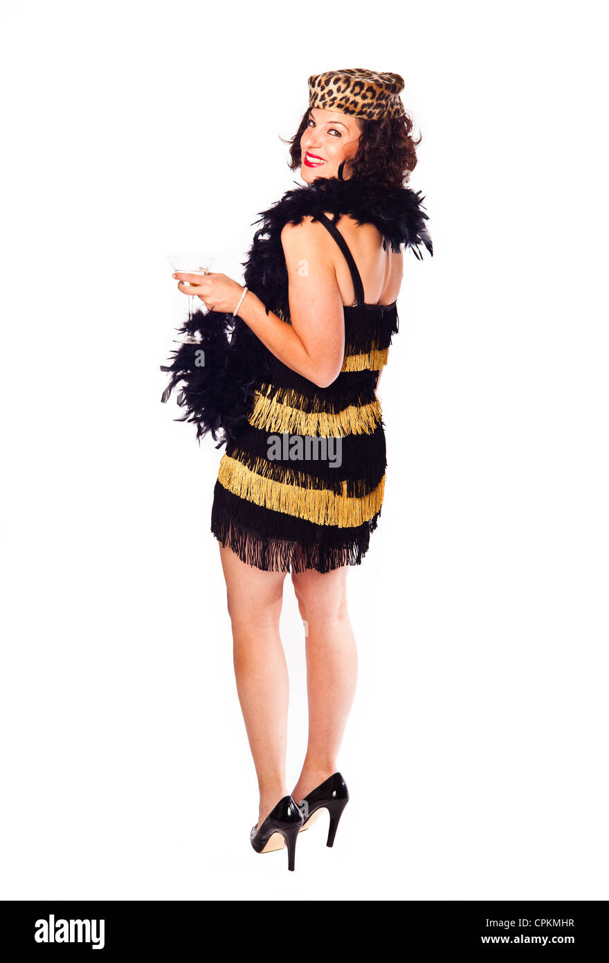 A brunette woman poses as a 1920's flapper in a lampshade dress. Image ...