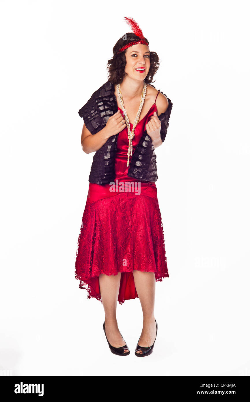 A brunette woman poses as a 1920's flapper Stock Photo - Alamy