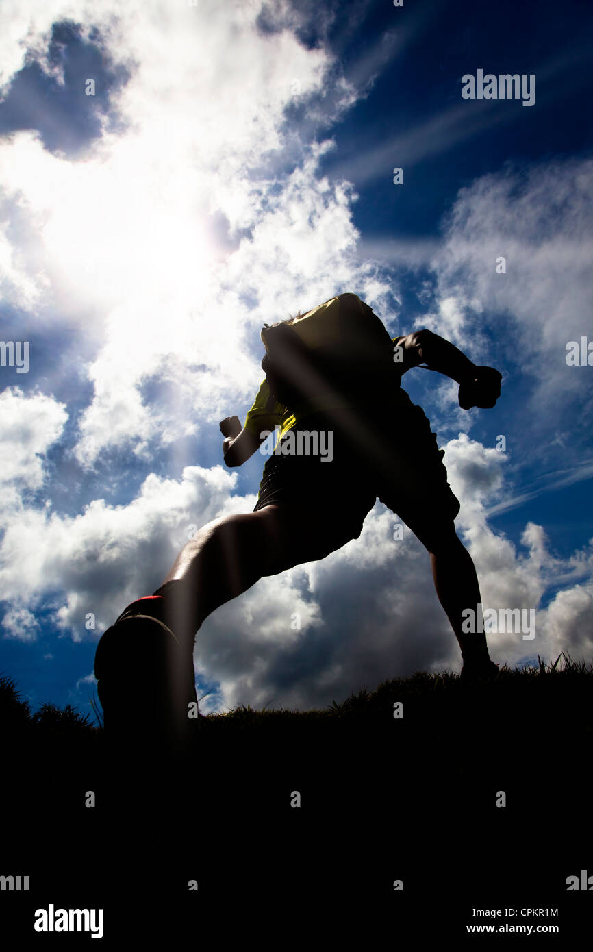 Silhouette runner grass sunlight mountain sun summer sport hi-res stock ...