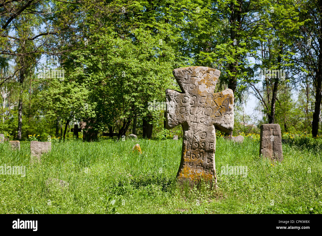 Ancient cross on the grass Stock Photo - Alamy