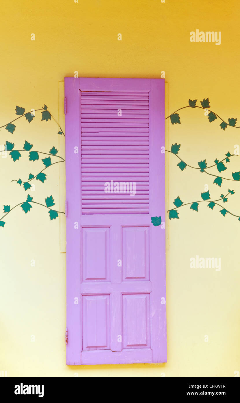 Violet door with decoration Stock Photo - Alamy