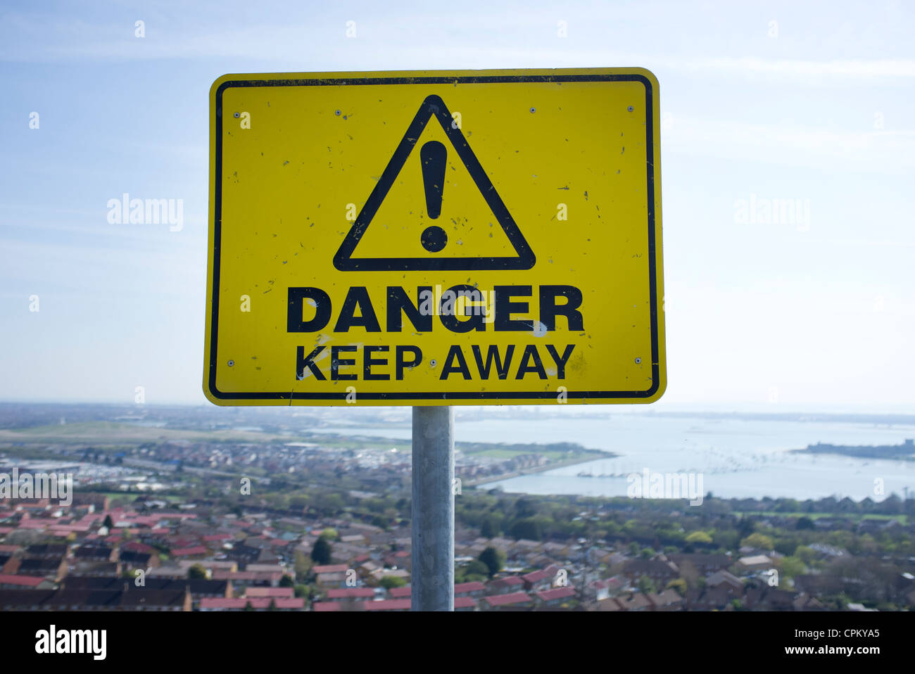 yellow warning danger keep away sign at portsdown hill Stock Photo - Alamy