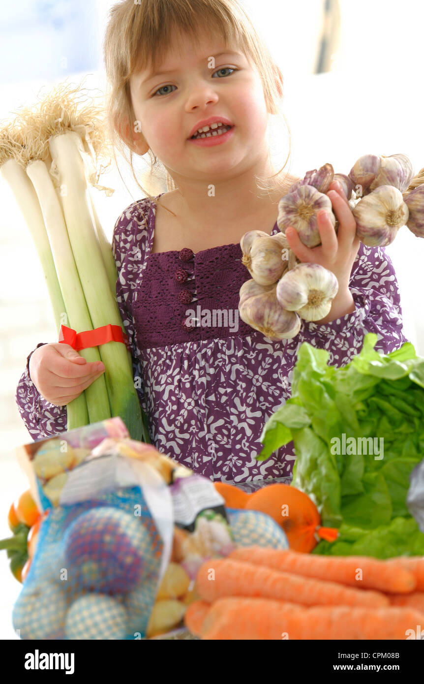 CHILD EATING VEGETABLE Stock Photo - Alamy