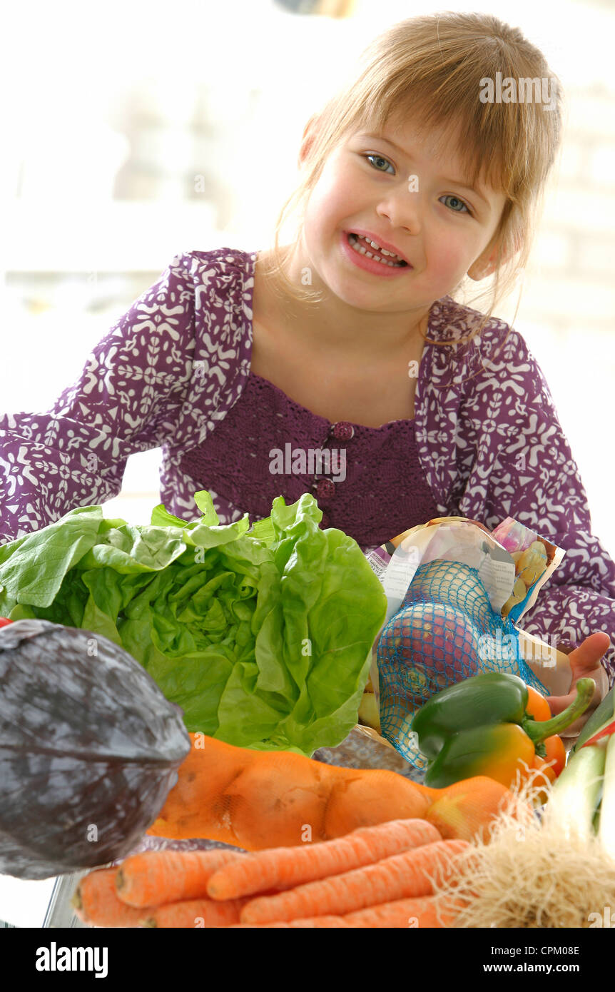 CHILD EATING VEGETABLE Stock Photo - Alamy