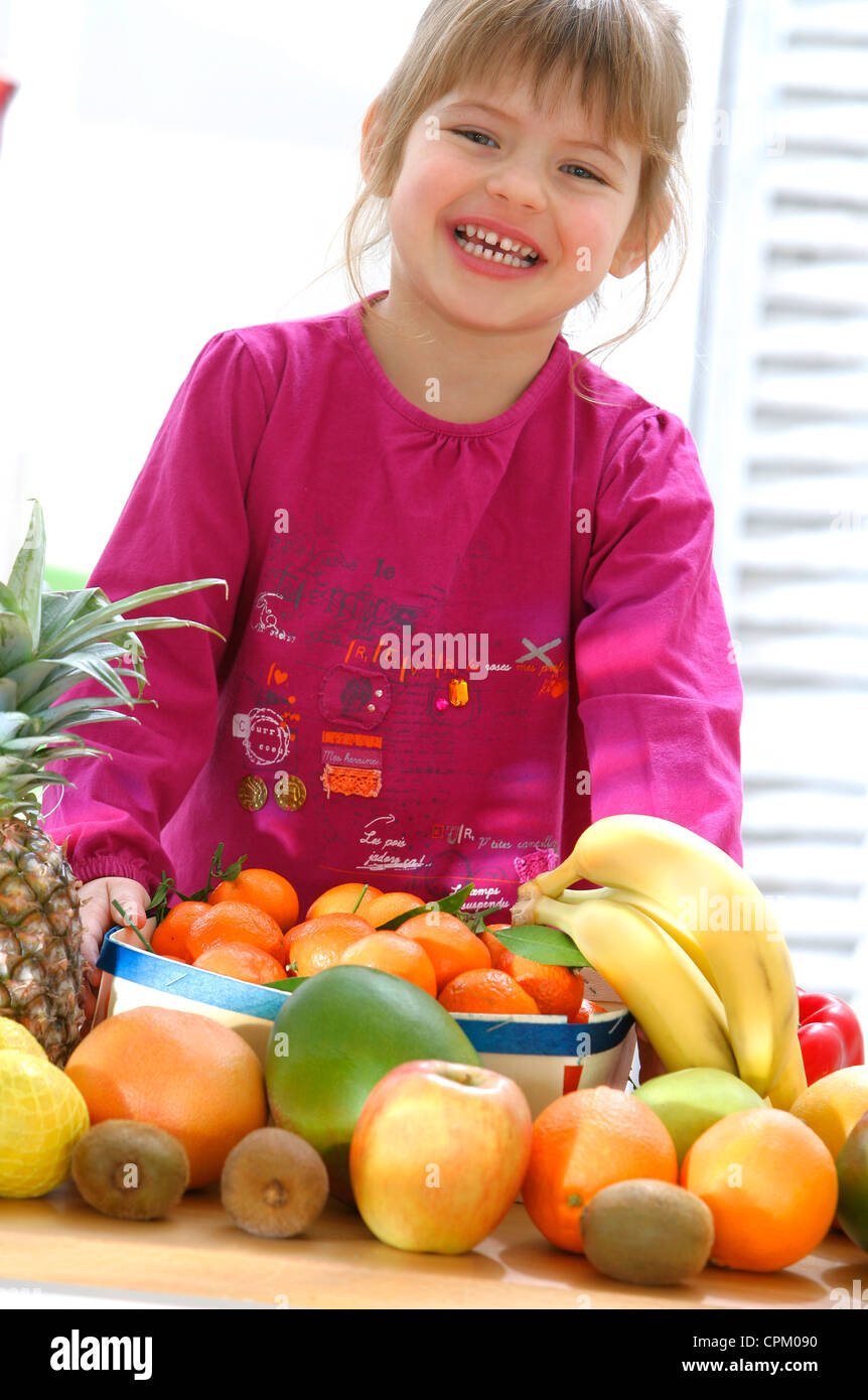 CHILD EATING FRUIT Stock Photo - Alamy