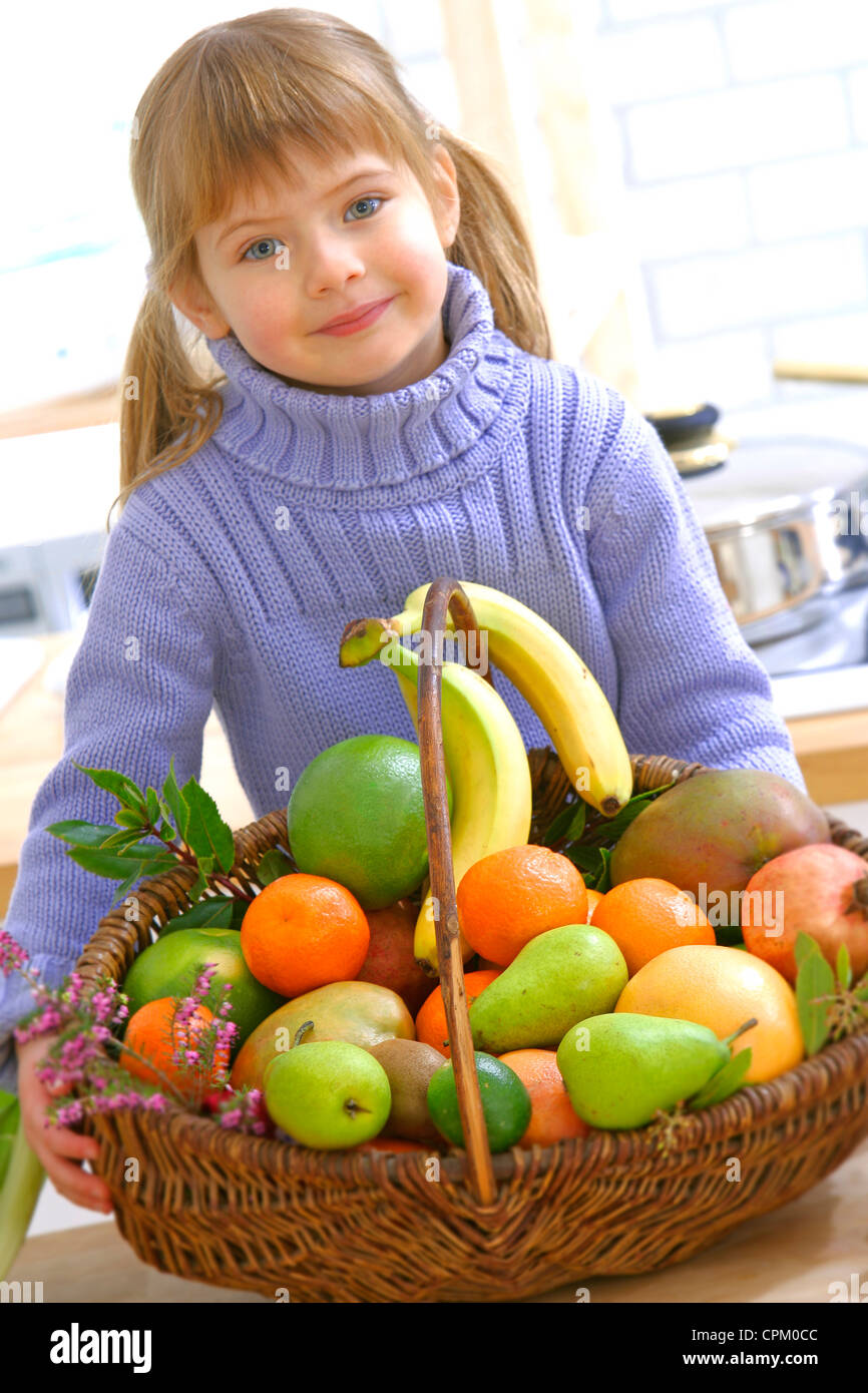 CHILD EATING FRUIT Stock Photo - Alamy