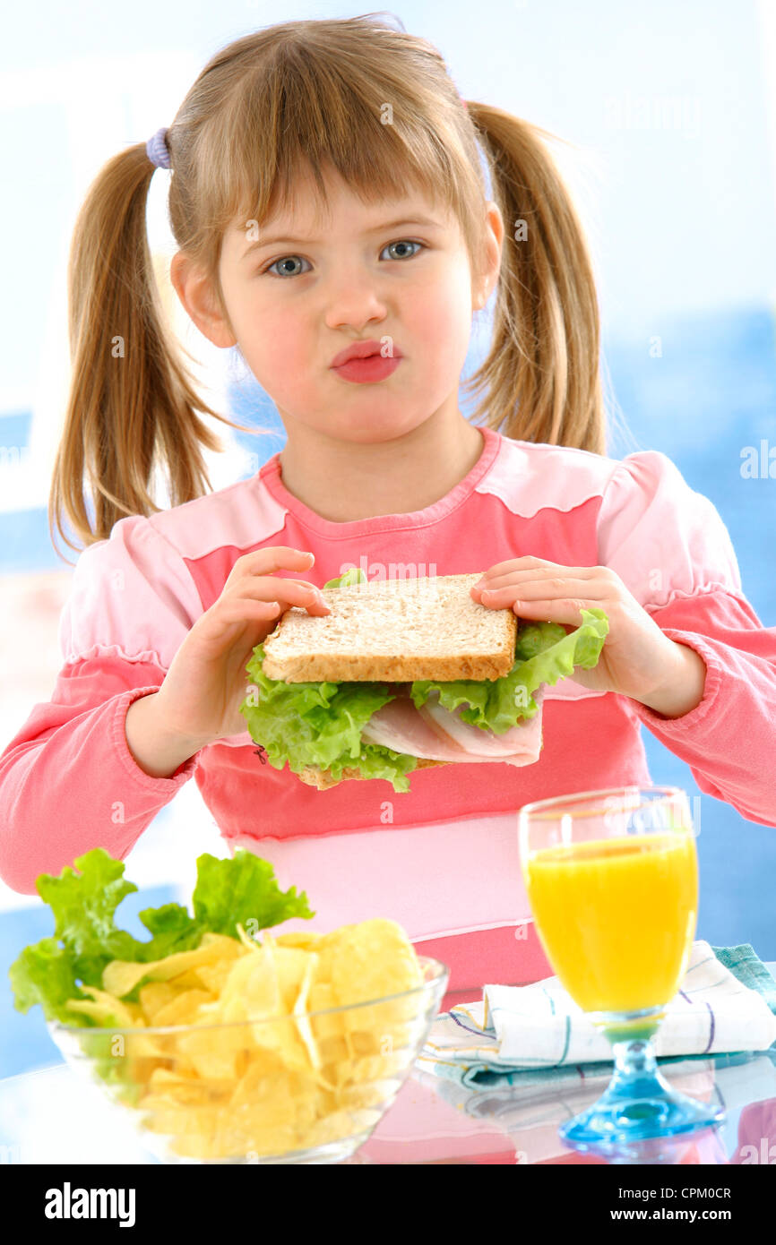 CHILD EATING A SANDWICH Stock Photo - Alamy