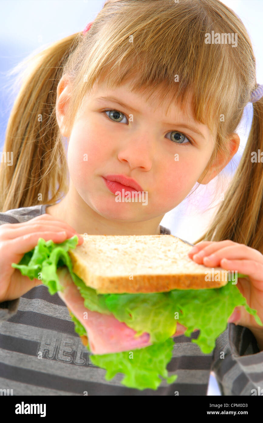 CHILD EATING A SANDWICH Stock Photo - Alamy