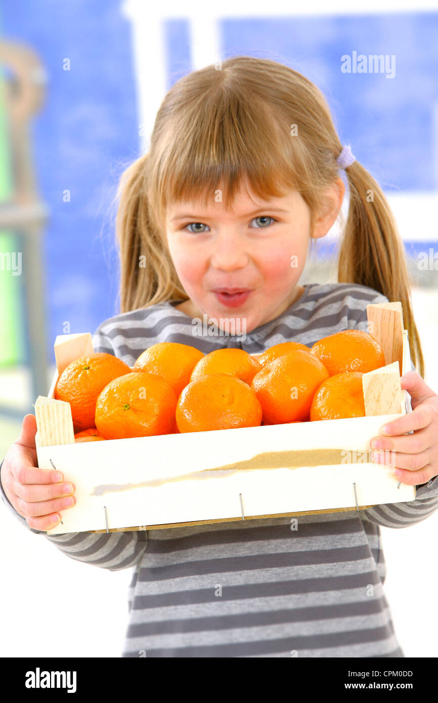 CHILD EATING FRUIT Stock Photo - Alamy
