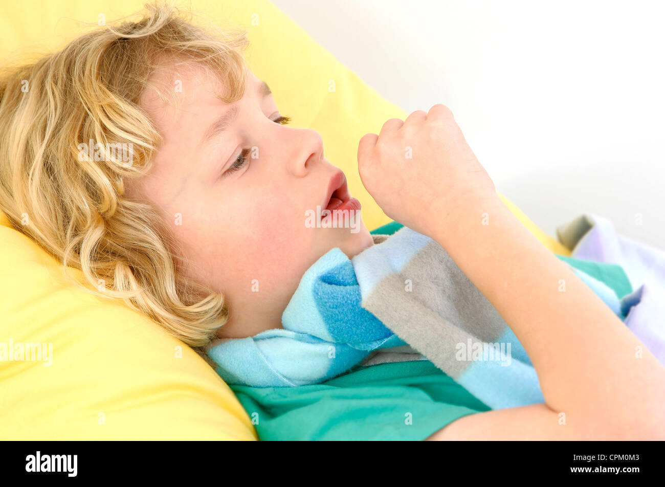 Sick boy in bed coughing hi-res stock photography and images - Alamy