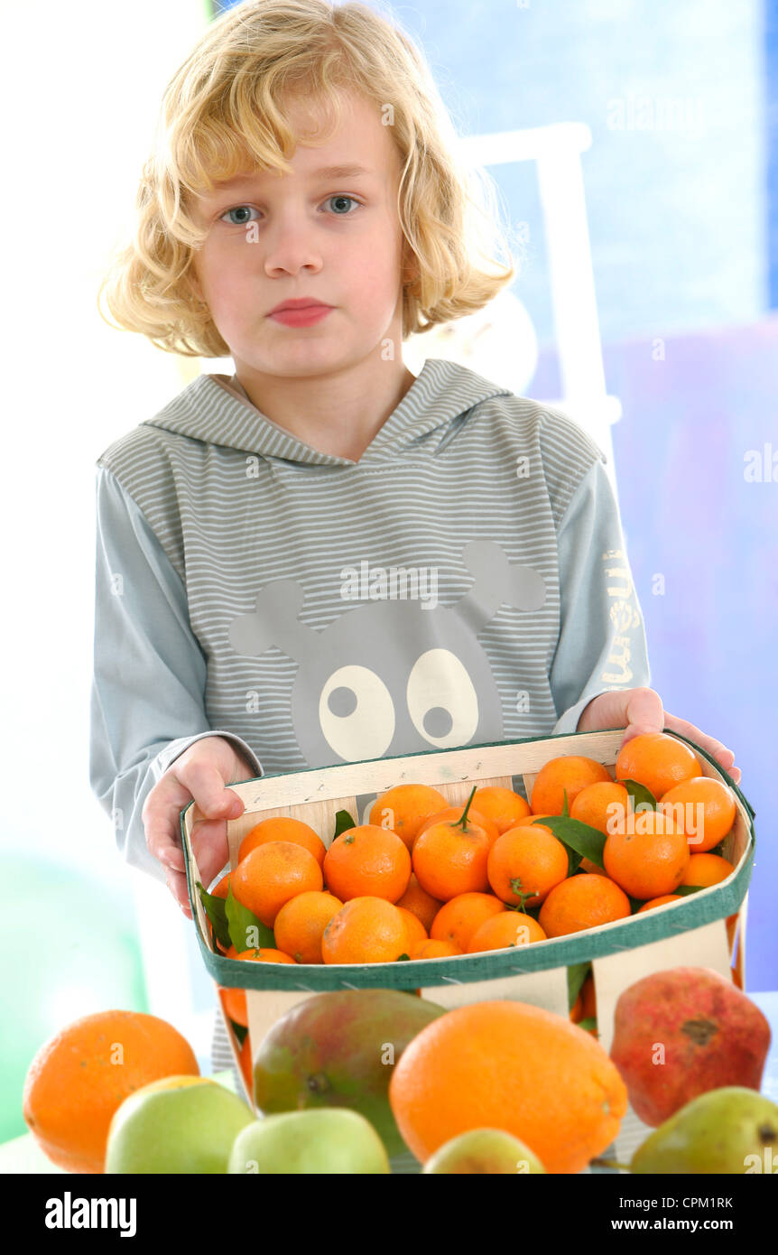 CHILD EATING FRUIT Stock Photo - Alamy
