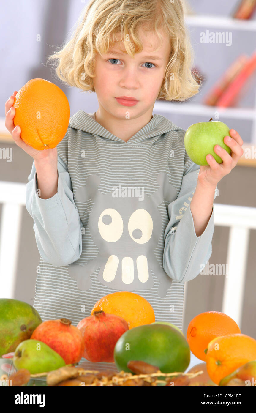 CHILD EATING FRUIT Stock Photo - Alamy