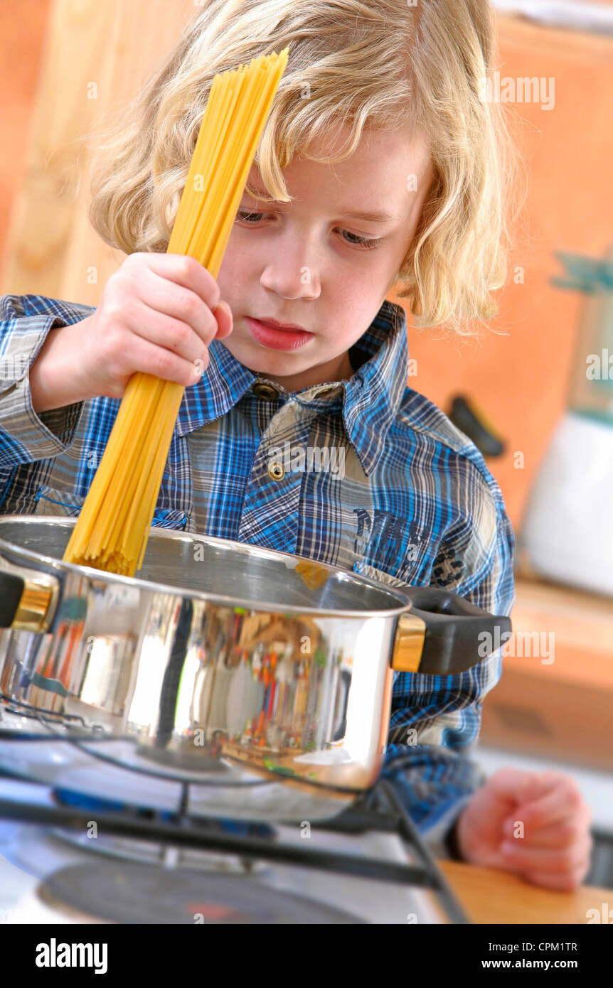 CHILD IN KITCHEN Stock Photo - Alamy