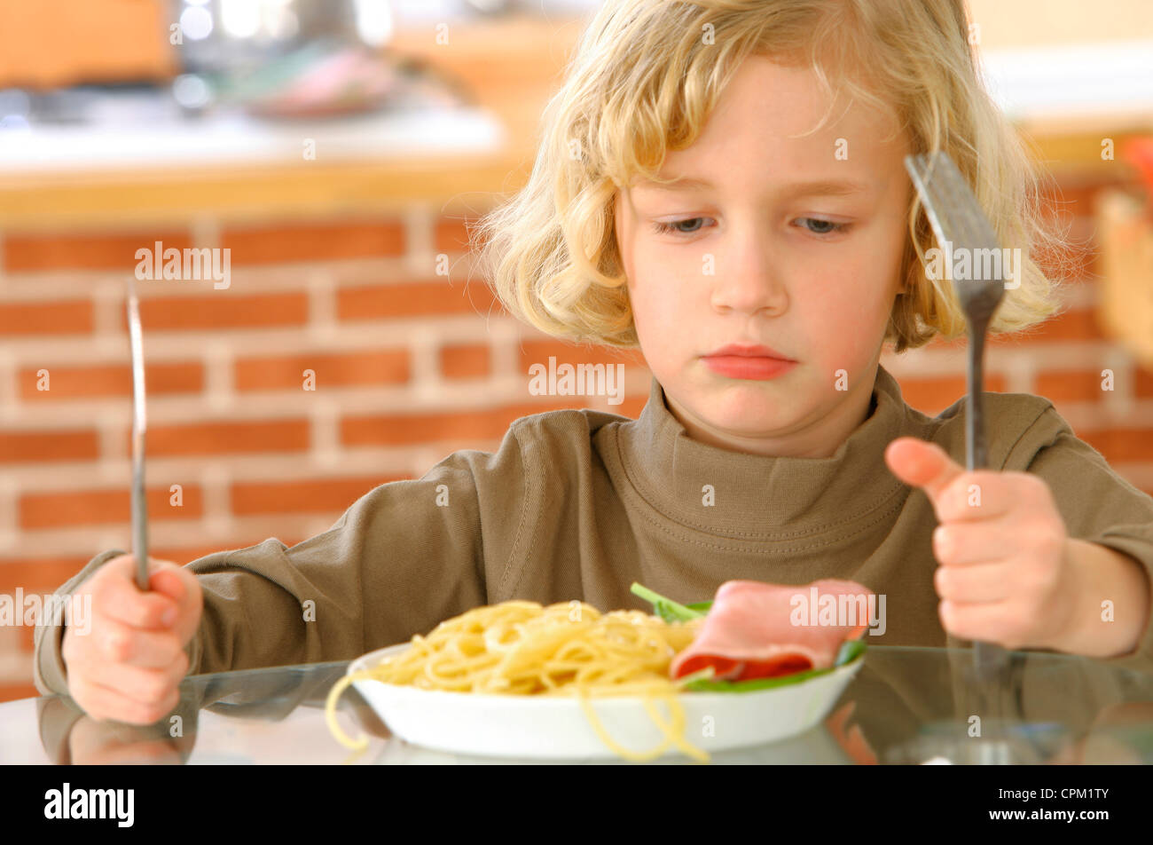 CHILD EATING A MEAL Stock Photo - Alamy