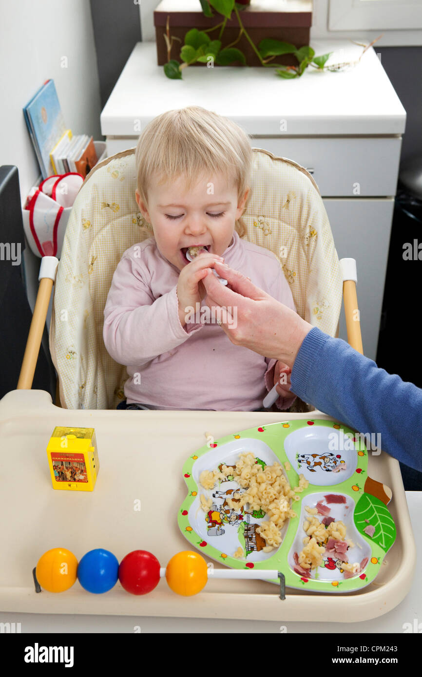 CHILD EATING A MEAL Stock Photo - Alamy