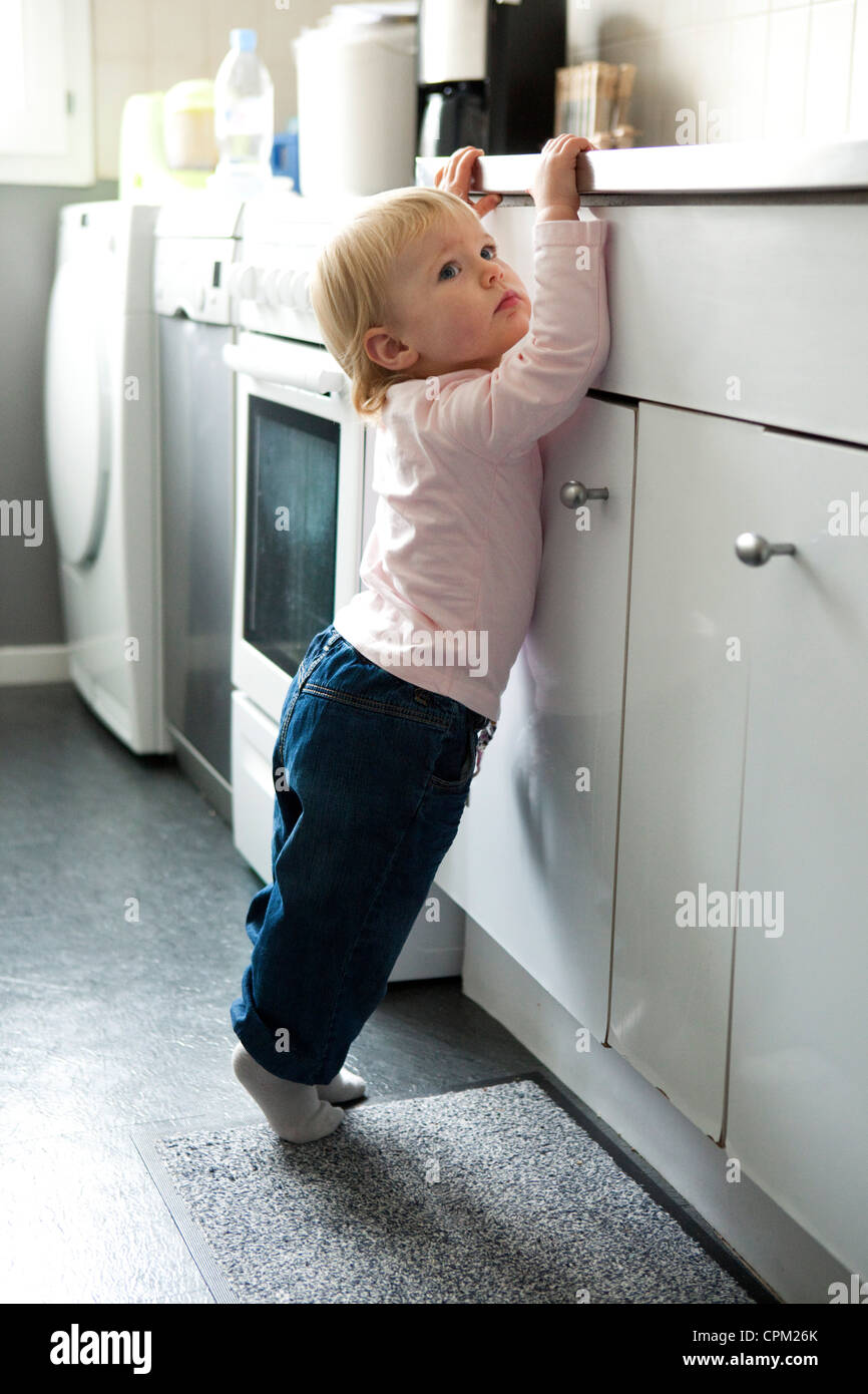 CHILD IN KITCHEN Stock Photo - Alamy