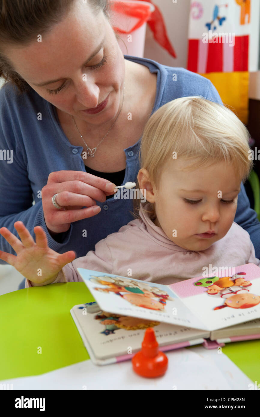 EAR HYGIENE CHILD Stock Photo - Alamy