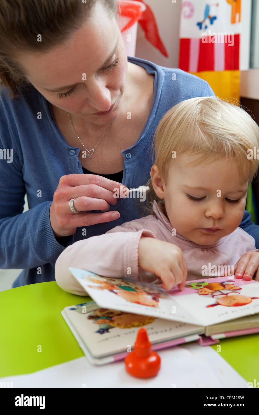 EAR HYGIENE CHILD Stock Photo - Alamy