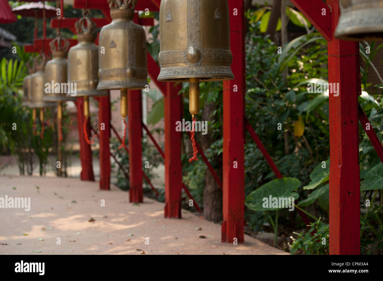Thai Bells in a shaded temple section Stock Photo - Alamy