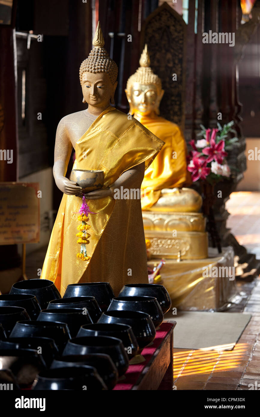 Buddha statues yellow cloth hi-res stock photography and images - Alamy
